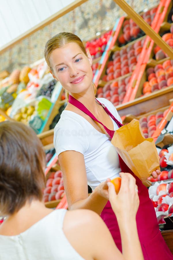 She giving fruit stock image. Image of attractive, produce - 244998995