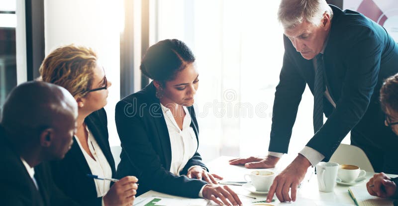 Giving His Input. a Group of Corporate Businesspeople Looking at ...