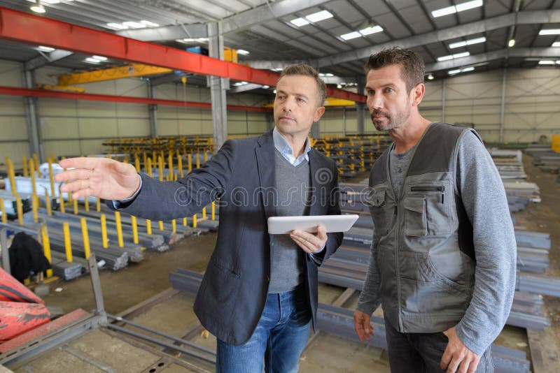 Man Showing Instructions Chart To Trainee Stock Image - Image of tour ...