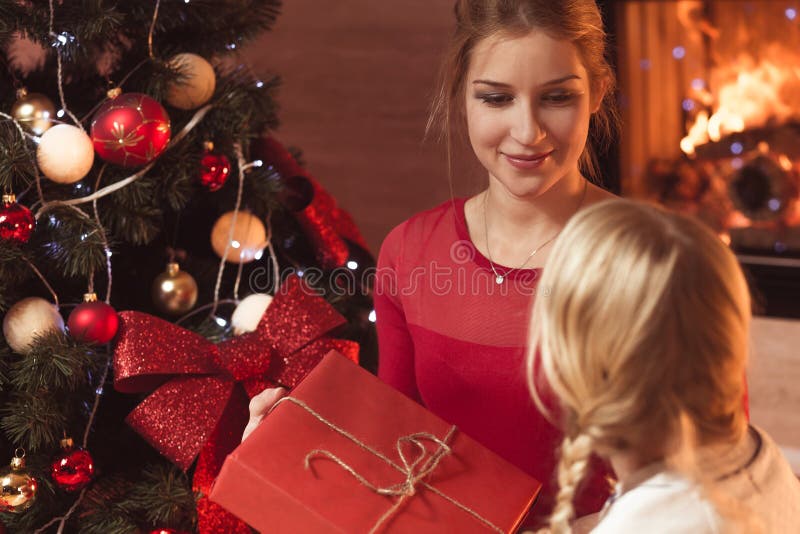 Giving Present at Christmas Stock Photo - Image of give, child: 78927298
