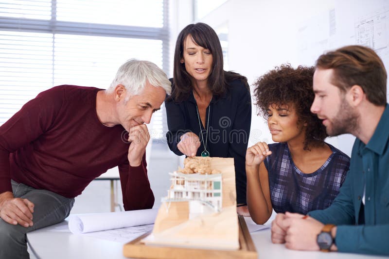 Giving Their Design Some Serious. a Group of Architects Working ...