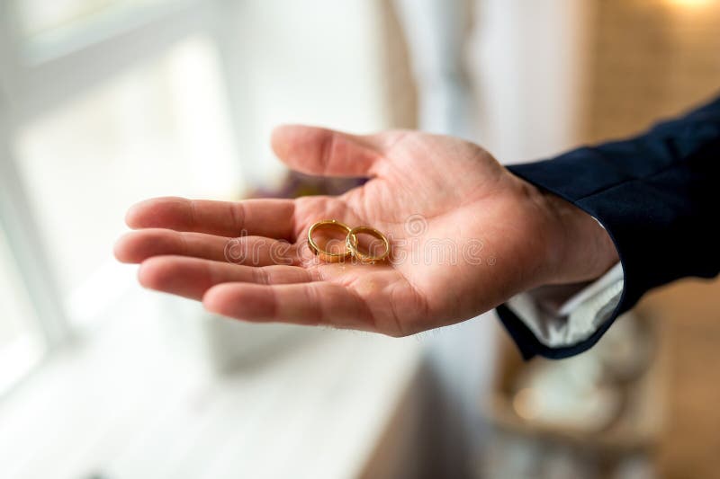 Giving of Wedding Ring. the Groom is Holding the Rings Stock Photo ...