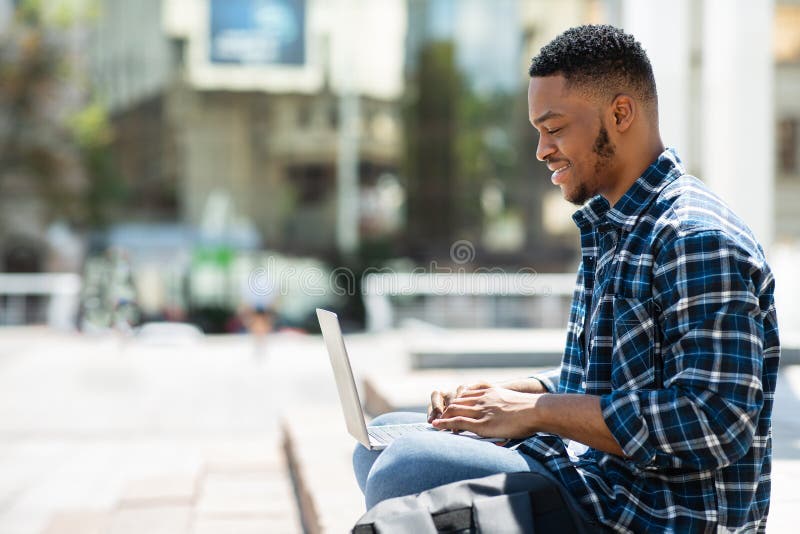 Glad Black Man Using Laptop Side View Stock Photos - Free & Royalty ...