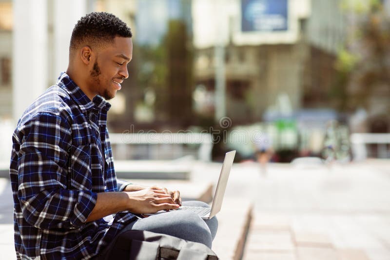 Glad Black Man Using Laptop Side View Stock Photos - Free & Royalty ...