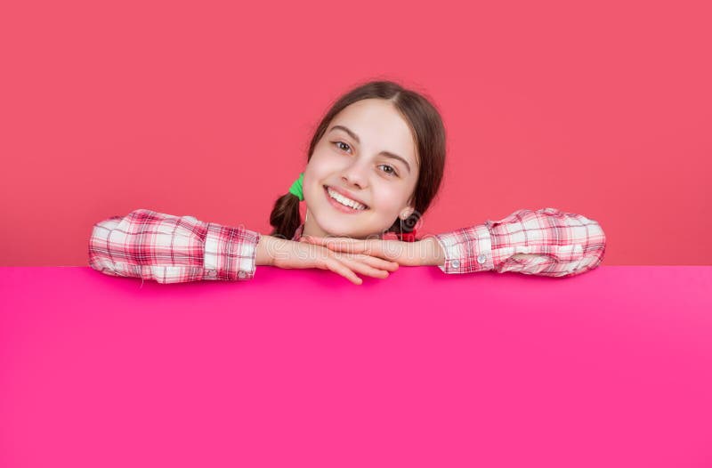 Glad Child Behind Blank Pink Paper with Copy Space for Advertisement ...