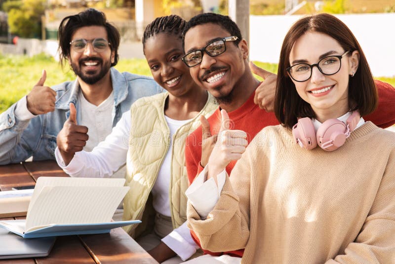 Glad Friendly Millennial Multiethnic Modern Students Read Books, Study ...