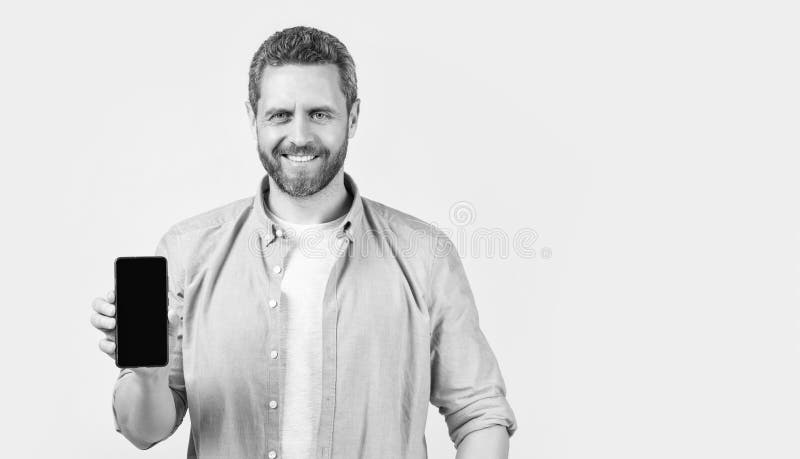 Glad Man Showing Phone App Isolated on Studio Background. Man Showing ...