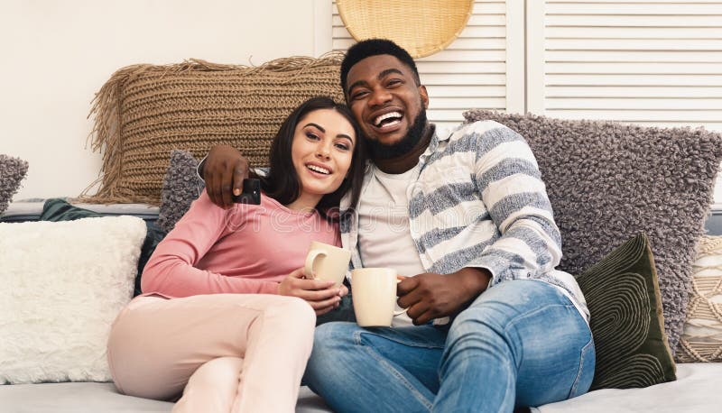 Glad Multiracial Millennial Family Resting at Home Stock Photo - Image ...