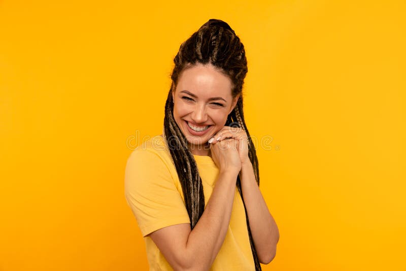 Glad Pleased Happy Young Woman in the Yellow Studio. Stock Image ...
