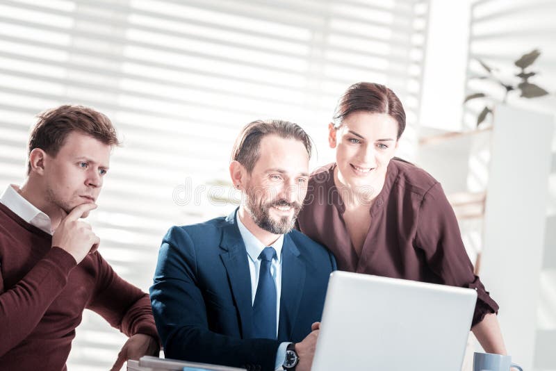 Glad Three Colleagues Conducting Meeting Stock Photo - Image of male ...