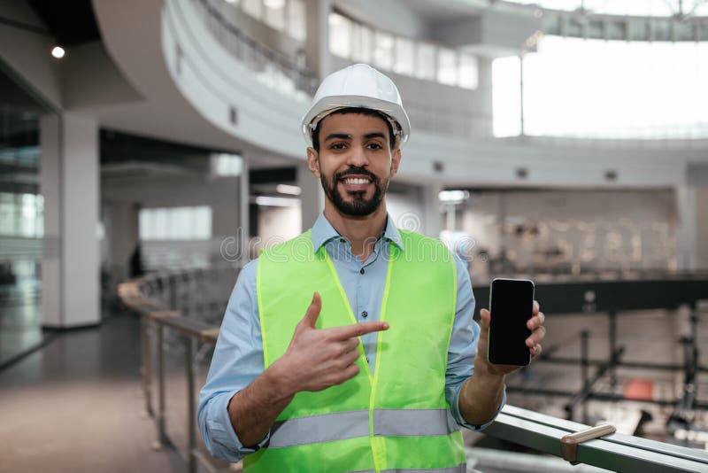 Glad Young Islamic Engineer Builder with Beard in Protective Clothing ...