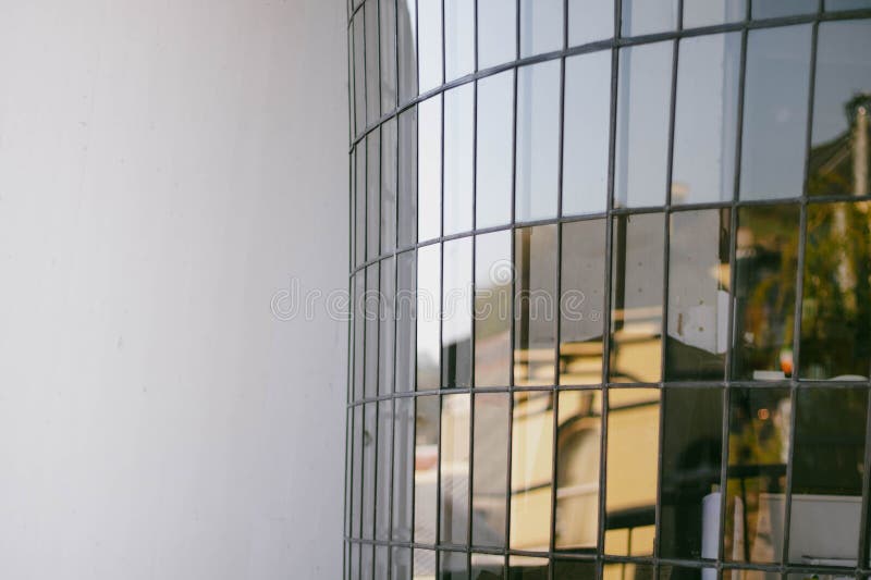 A Glare-curving Window Consisting of Small Rectangular Panes of Glass ...