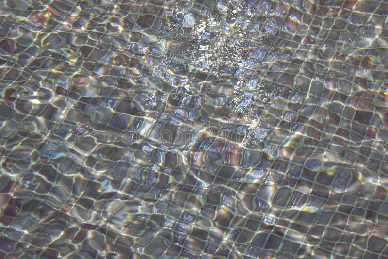 Glare on Water in Pool. Water Surface with Bizarre Small Waves ...