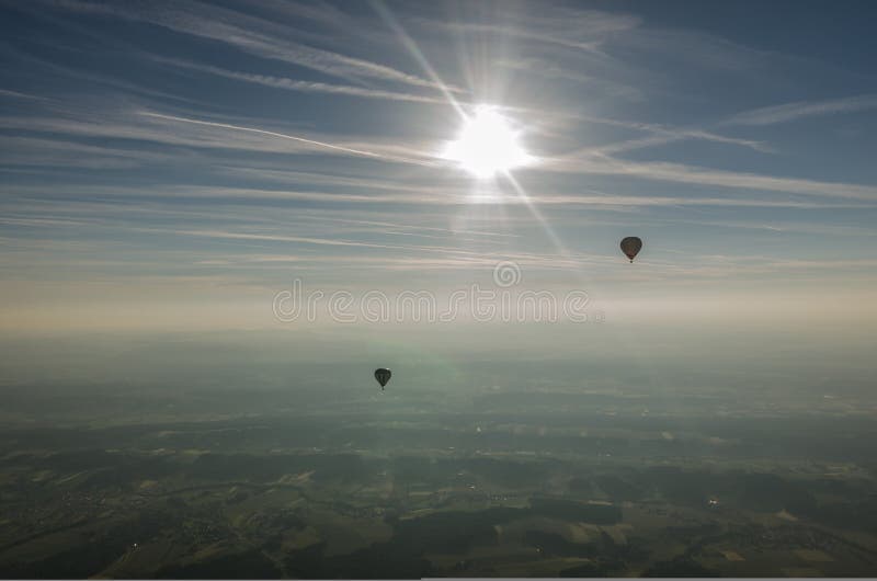 Glaring sun and balloons stock photo. Image of colorful - 111128090