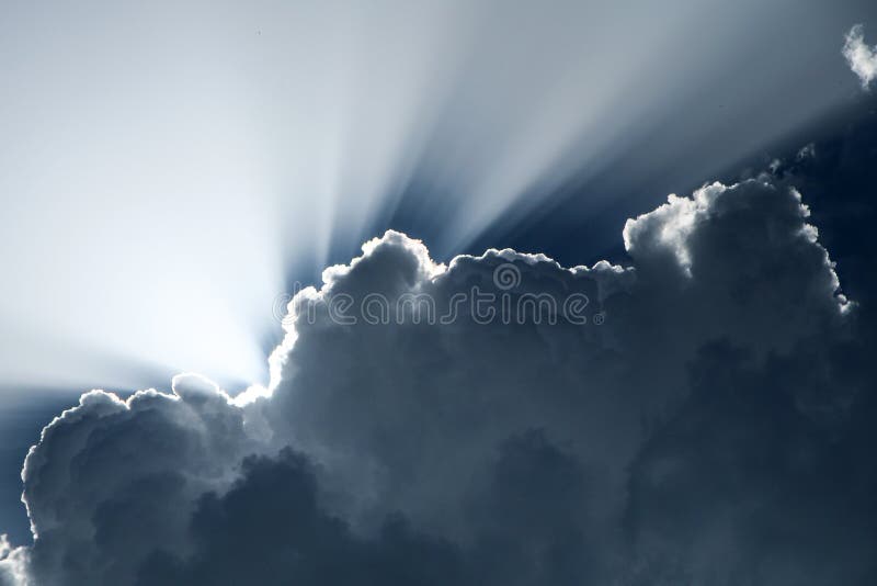 Glaring the Sun Ray Behind a Cloud Stock Image - Image of cloudy, glow ...