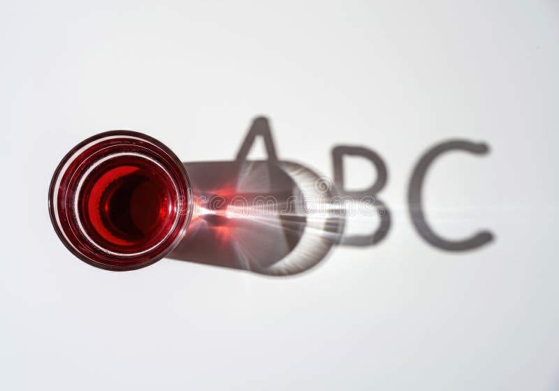 Glass of ABC Juice Casting ABC Shadow on White Surface Stock Photo ...