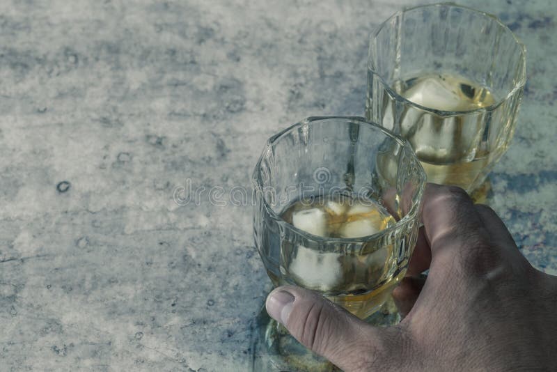A Glass with Alcohol and a Hand Reach for it. Stock Image - Image of ...