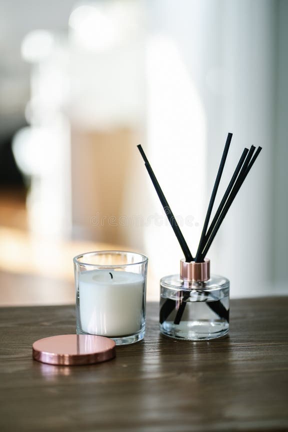 An Aromatic Reed Diffuser Stands on a Table Against a Blurry Background ...