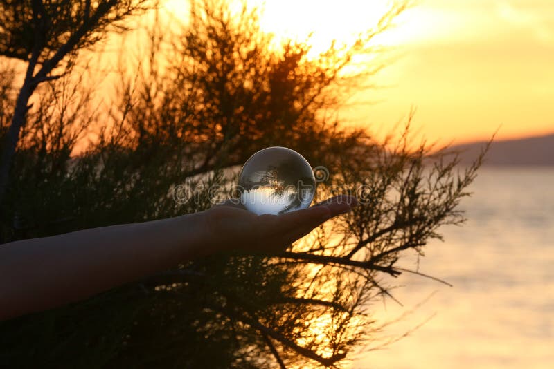 Sunset. Glass Ball Reflection of Sea Sunset Stock Image - Image of hand ...
