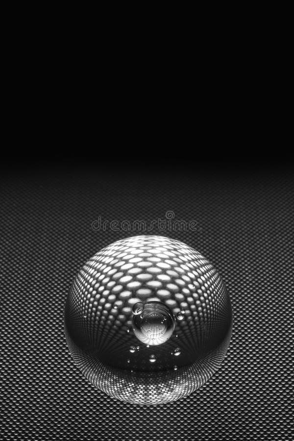 Glass Ball on a Surface with Round Holes Stock Photo - Image of space ...