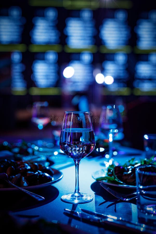 Glass on a banquet table. stock photo. Image of gathering - 220410404