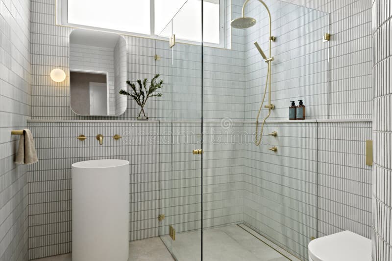 Glass Bathroom with Elegant Brass Fixtures Inside Stock Photo - Image ...