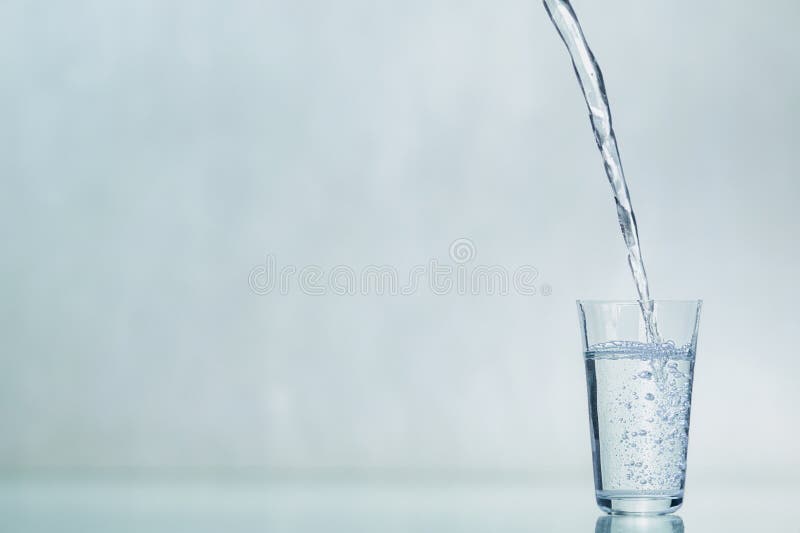 A Glass Beaker is Filled with Water. the Process of Filling a Glass ...