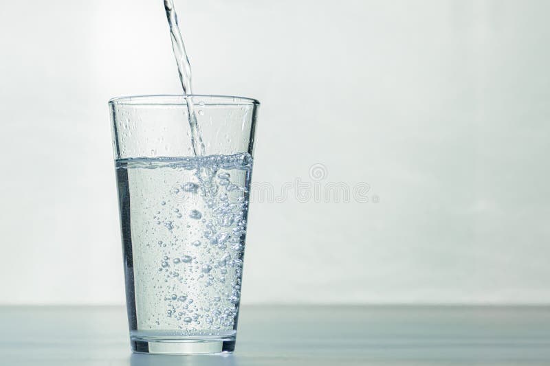 A Glass Beaker is Filled with Water. the Process of Filling a Glass ...