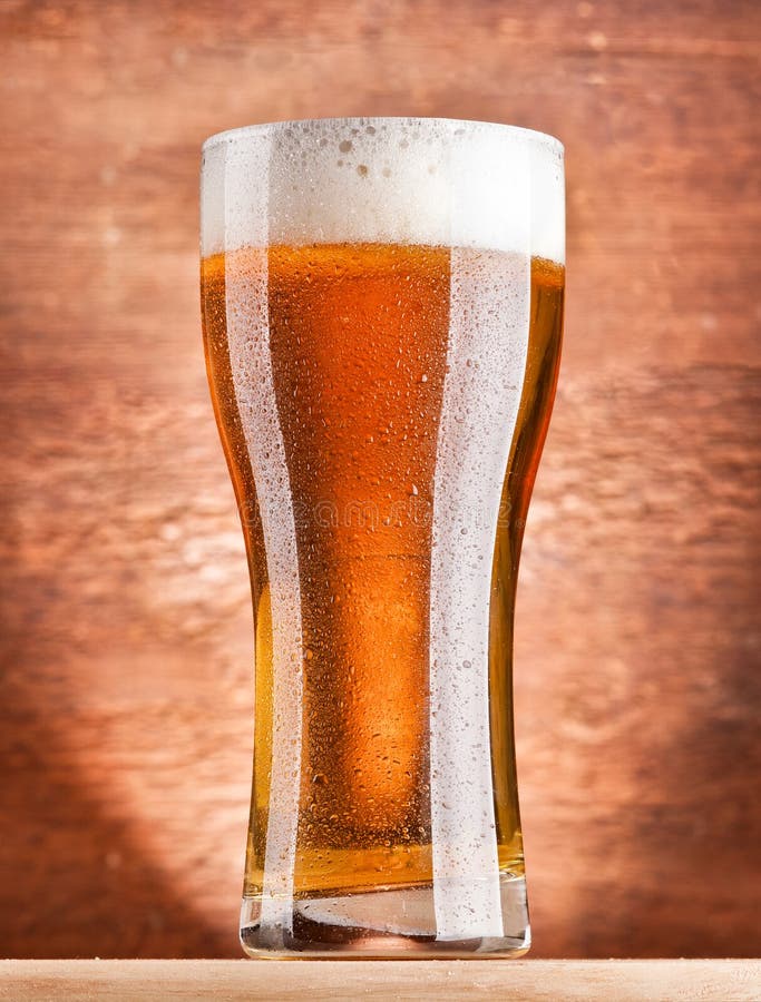 Pouring Beer in Glass on Bar Desk Stock Image - Image of amber, brown ...