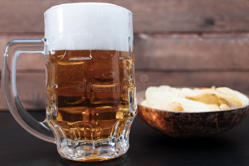 A glass of beer and chips stock photo. Image of fresh - 269505062