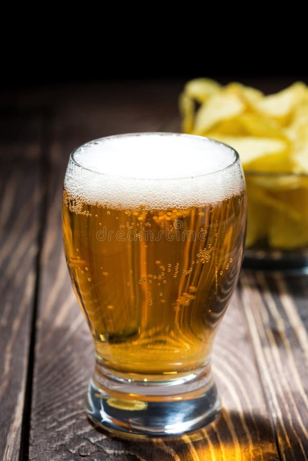 Glass of beer and chips stock image. Image of lager, beverage - 86276967