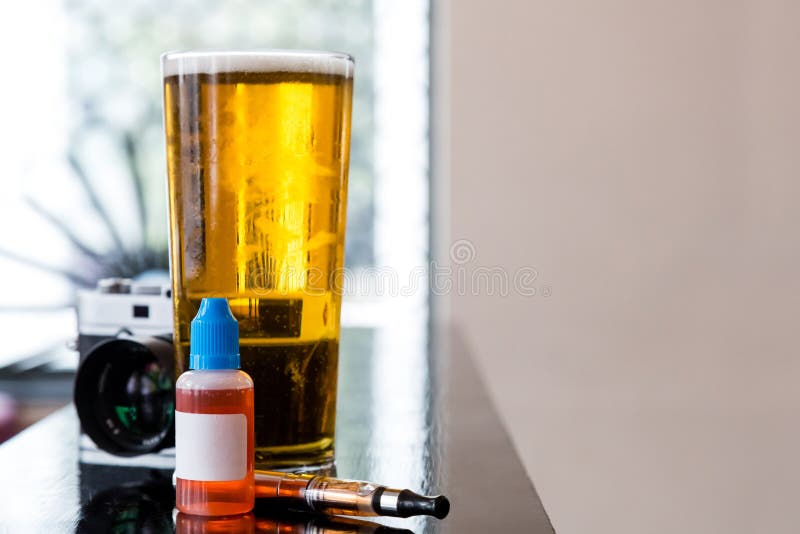 Glass of Beer and Gadgets on Table Stock Photo - Image of addictive ...