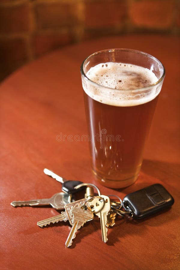 Glass of Beer and Keys on Bar Table Stock Photo - Image of recreation ...