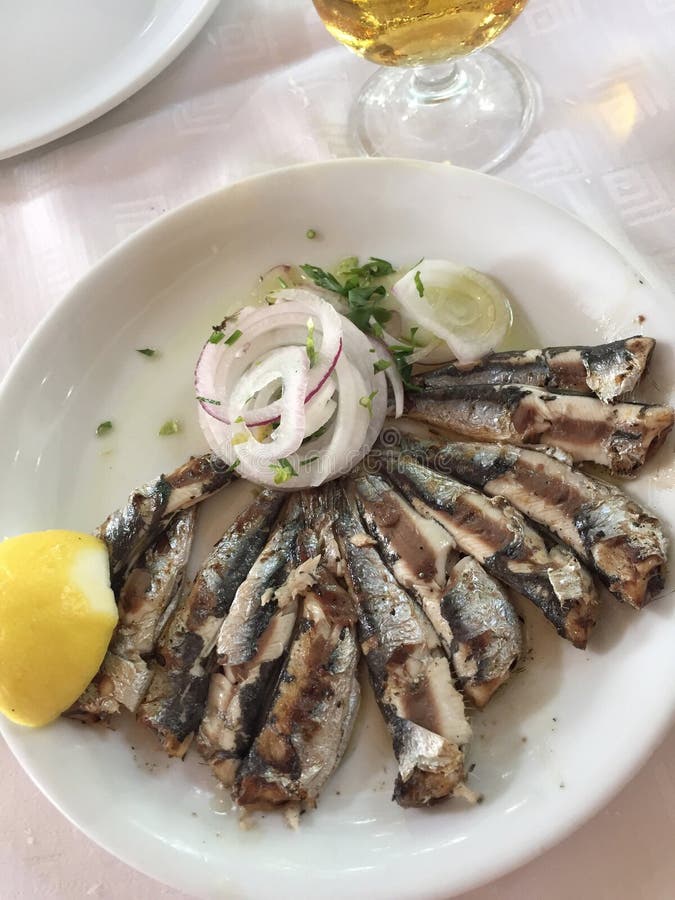 Beer and sardines on table stock image. Image of beer - 99693981