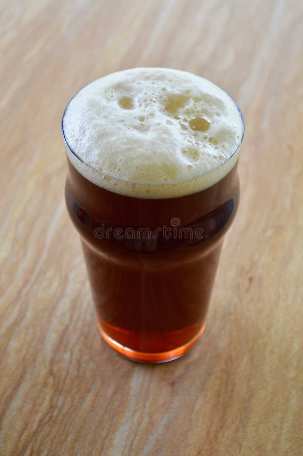 A Glass of Beer on the Table Stock Image - Image of beers, beer: 232139305