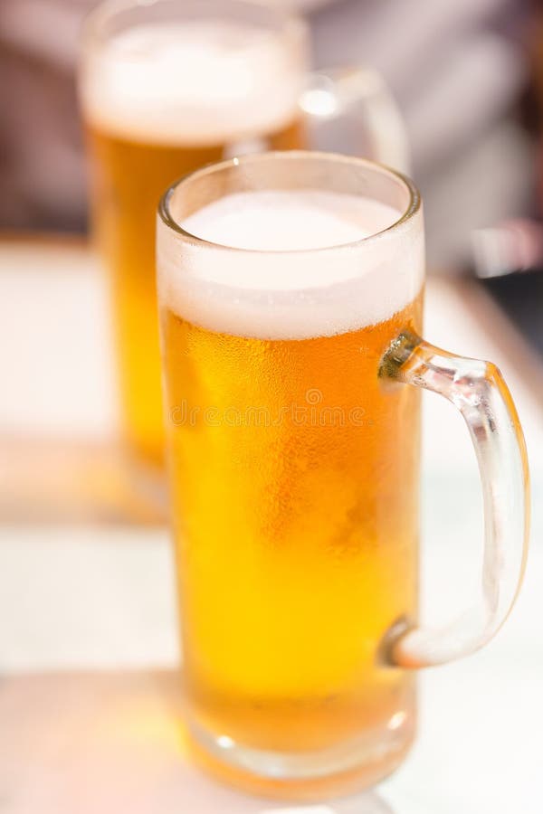 Glass of Beer on a Table Top Stock Image - Image of party, refreshment ...