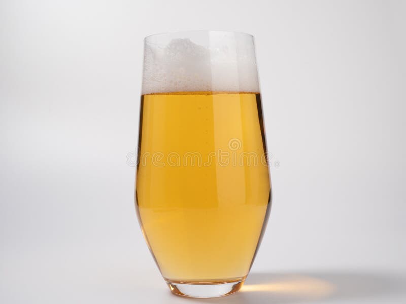 Glass of Beer on a White Background. a Glass of Light Beer with Foam ...