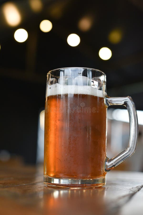 Glass of Beer on Wooden Table. Beer in a Glass Stock Photo - Image of ...