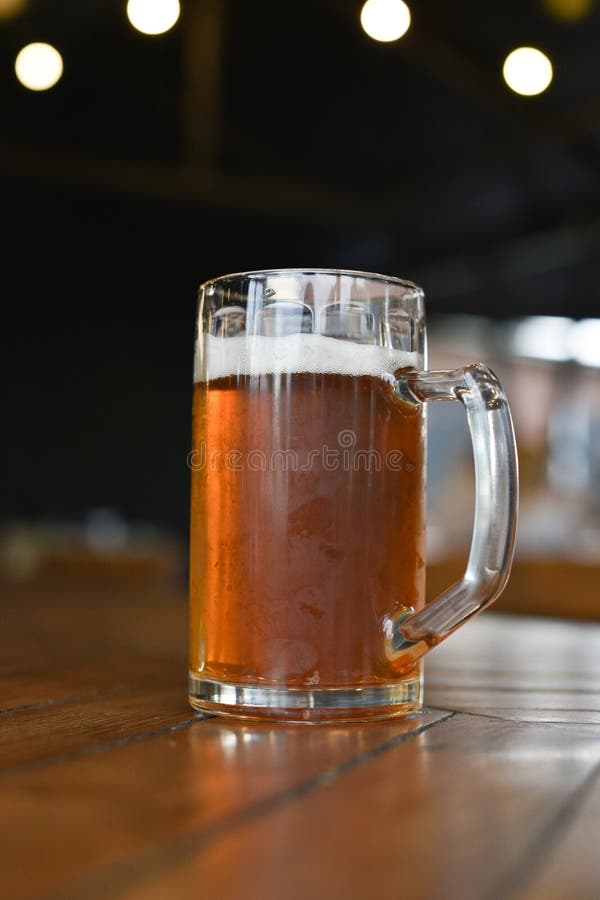 Glass of Beer on Wooden Table. Beer in a Glass Stock Image - Image of ...