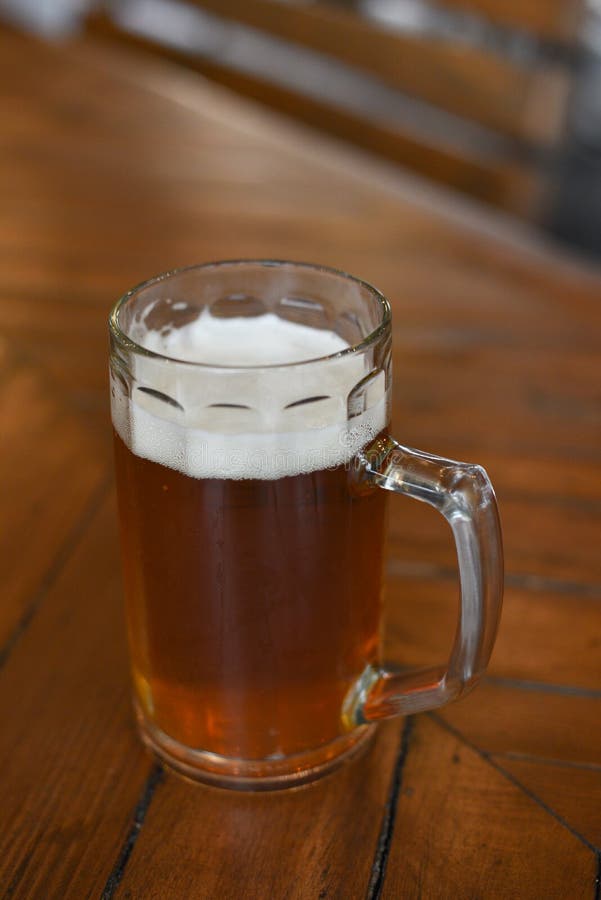 Glass of Beer on Wooden Table. Beer in a Glass Stock Image - Image of ...