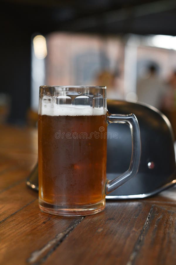 Glass of Beer on Wooden Table. Beer in a Glass Stock Image - Image of ...