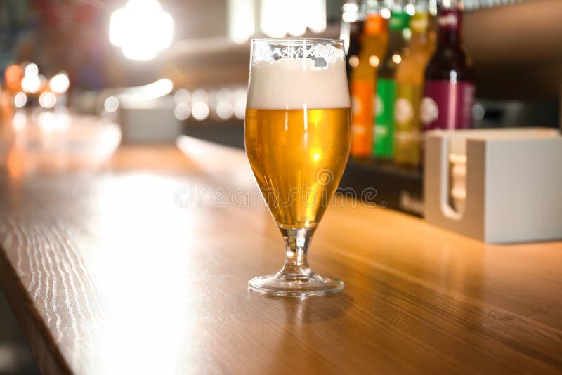 Glass of Beer on Table in Pub Stock Image - Image of alcohol, nightclub ...