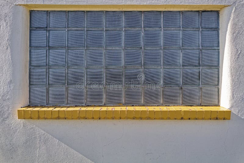 A Glass Block Window is Installed on the Plaster Wall of a Building ...
