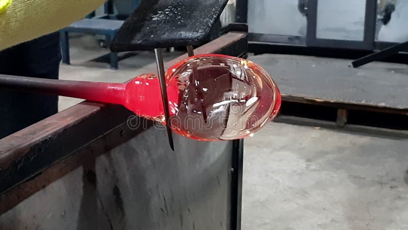 Glassblowing Artist Rolling Melted Glass on Color Powder Adding Colour ...