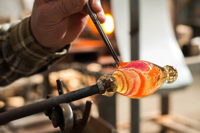 Glass Blowing the Hands of the Craftsman Working with Molten Glass ...