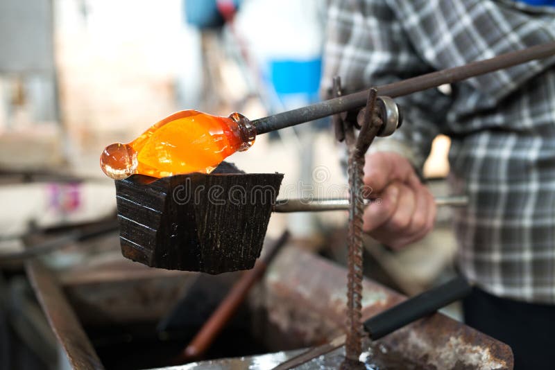 Glass Blowing the Hands of the Craftsman Working with Molten Glass ...
