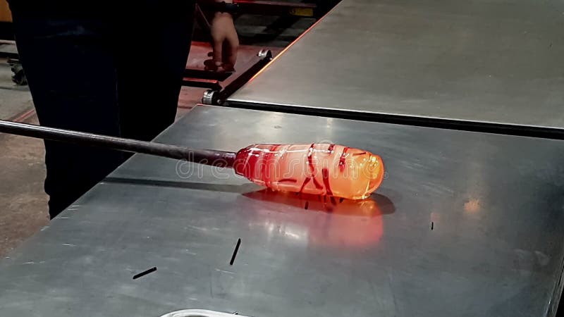 Glassblowing Artist Rolling Melted Glass on Color Powder Adding Colour ...