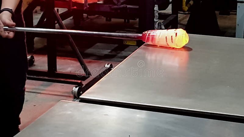 Glassblowing Artist Rolling Melted Glass on Color Powder Adding Colour ...