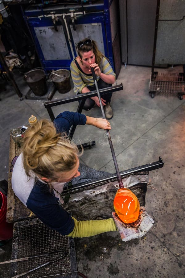 Two Women Shaping Blown Glass on the Blowpipe Editorial Photography ...