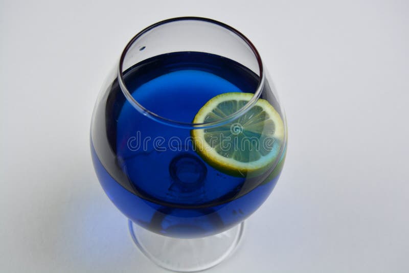 Glass with Blue Drink and Lemon Stock Image - Image of blue, drop ...